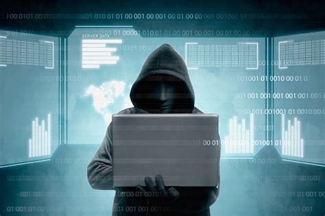 Hacker In Black Hoodie Holding Laptop And Virtual Screen Display The