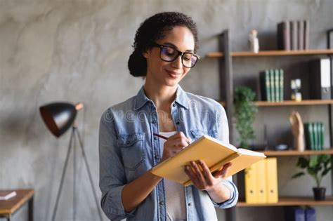 Photo Of Attractive Corporate Agent Girl Write Notepad Loft Interior