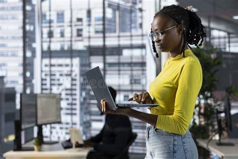 Cybersecurity Expert Using Laptop To Look For Company Security Vulnerabilities Stock Image
