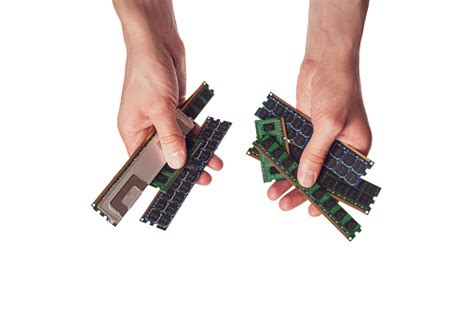Hand Holding Ram Modules To Assemble A Computer Choosing The Right Components For A Computer