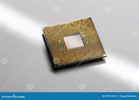 pins of a amd ryzen 5 cpu processor on grey background editorial