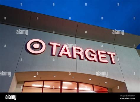 Night View Of Facade With Illuminated Logo And Sign At Target Consumer