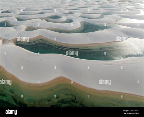Aerial View Of Lencois Maranhenses White Sand Dunes With Pools Of