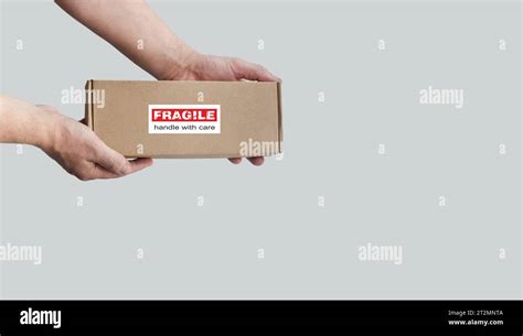 A Rectangular Cardboard Box Monochrome Light Background An Adhesive