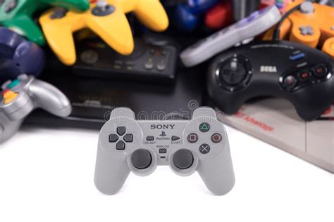 A Pile Of Retro Video Game Controllers Editorial Image Image Of