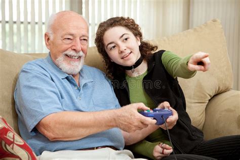 Grandpa And Teen Play Video Games Stock Image Image Of Playing