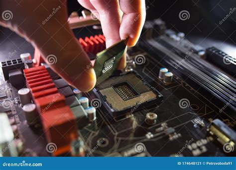 Technician Plug In CPU Microprocessor To Motherboard Socket Workshop