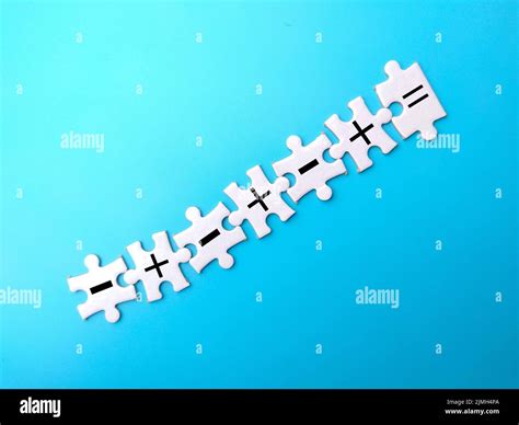 White Puzzles With Symbols Of Subtract Add And Equal To On Blue Background Education Concept