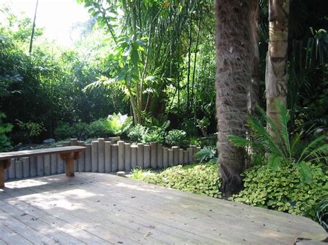 Custom Deck In Small Tropical Garden Rounds Define Decomposed Granite
