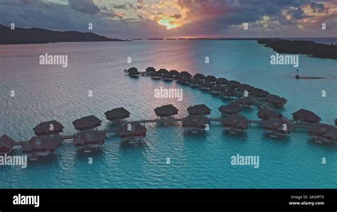 Colorful Tropical Sunset Over Overwater Bungalows Resort Bora Bora
