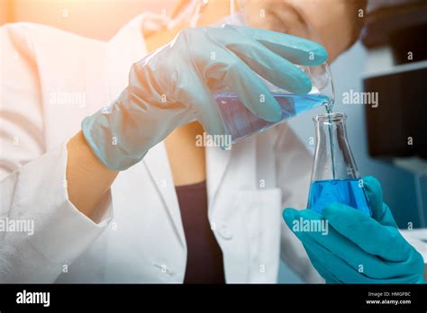 Woman Spends Experiments With Flask In Chemistry Lab Stock Photo Alamy