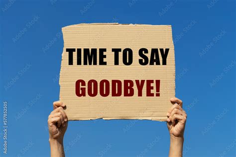 Time To Say Goodbye Text On Box Paper Held By 2 Hands With Isolated Blue Sky Background This