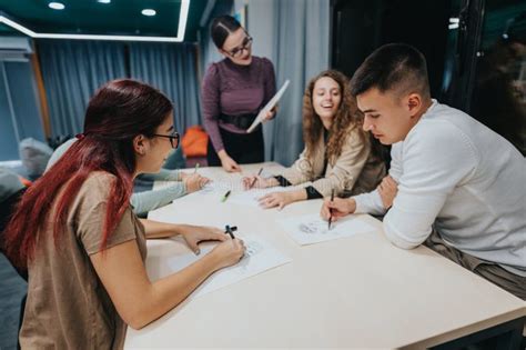 Young Students Collaborating On A Group Project In A Modern Classroom