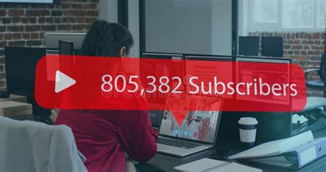 Young Asian Woman Monitors Subscriber Count At Her Workstation Stock