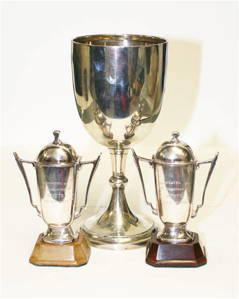 Bonhams A Silver Trophy Cup Two Small Silver Trophy Cups Assorted Medals And Coins