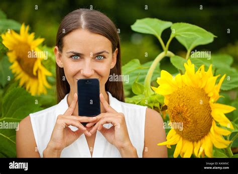 Young Beautiful Brunette Woman Showing Your Smartphone Screen Summer