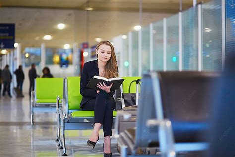 woman in international airport terminalreading book cabin stylish terminal photo background and