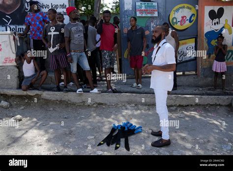 Nertil Marcelin Center Leader Of A Community Group Stand With