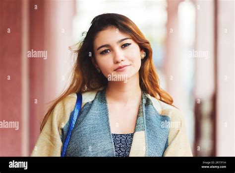 Outdoor Fashion Portrait Of Young 20 Year Old Girl Wearing Grey And