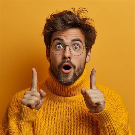Premium Photo A Man Wearing A Yellow Sweater With A Funny Face And