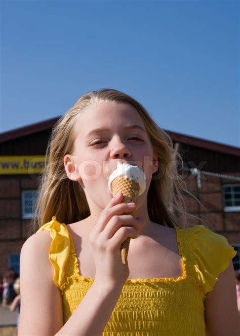 A Teenage Girl Eating Ice Cream Stock Image Colourbox