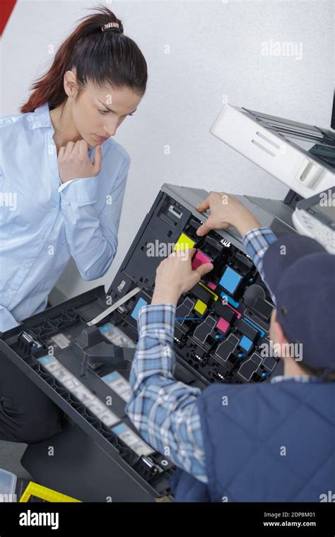Showing The Woman How To Replace The Ink Cartridge Stock Photo Alamy