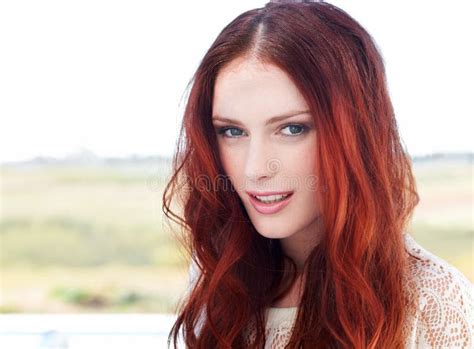 Radiant Redhead A Beautiful Young Redhead Woman Standing Outside