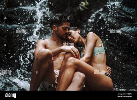 Beautiful Romantic Couple Enjoying Their Time Together At A Waterfall