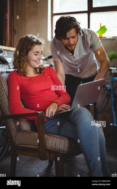 Couple Using Laptop Stock Photo Alamy