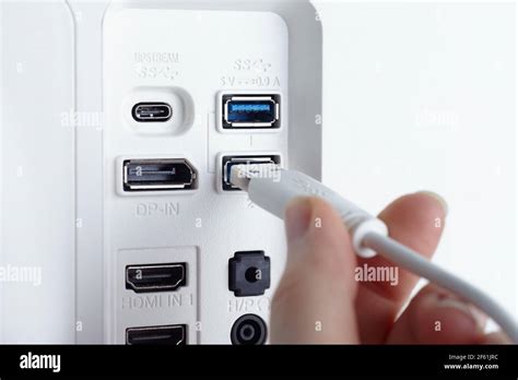 Close Up Of The Cable Connection With The Monitor S Built In USB Hub With Hand Stock Photo Alamy