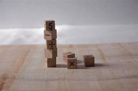 Premium Photo A Wooden Cubes With Numbers On A Table