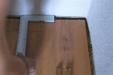 Premium Photo Male Repairman Installation Of Baseboards Room Renovation