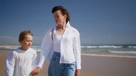 Relaxed Boy Walking Mom On Sunny Windy Beach Happy Mother Son Enjoying Vacation Stock Video