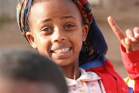An Eritrean Girl Makes The Sign With Her Index Finger And Looks Towards The Camera On The