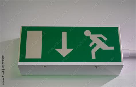 Emergency Exit Sign Hanging On A Wall Stock Photo Adobe Stock