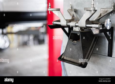 A Detailed View Of A Wheel Alignment Tool Used In An Automotive Repair Shop Highlighting