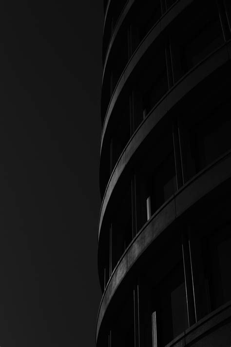Black And White Photo Of A City Building With Round Facade · Free Stock