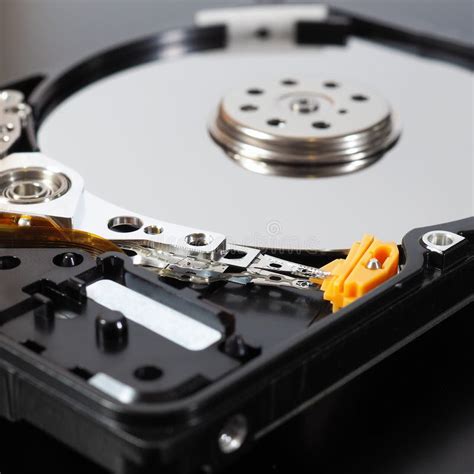 An Open Hard Disk Drive Of A Computer Or Laptop HDD Lies On A Dark Matte Surface Stock Photo