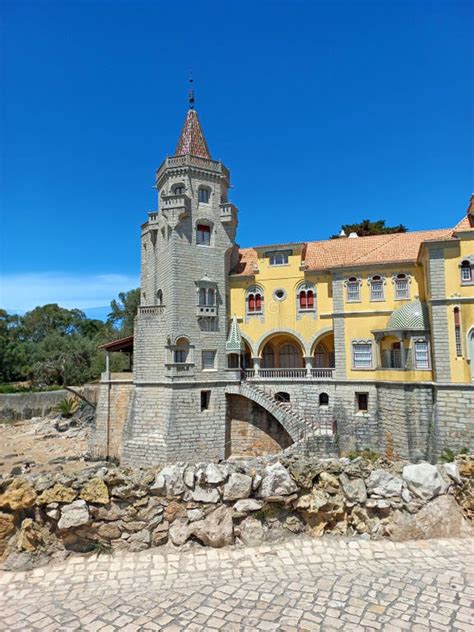 Colorful Cidadela Palace In Cascais Portugal With Stone Tower And