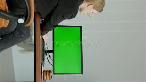 Woman Working On Desktop Computer With Green Screen Mock Up In Modern