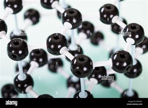 Model Of Graphite Molecular Structure On Green Reflective Background