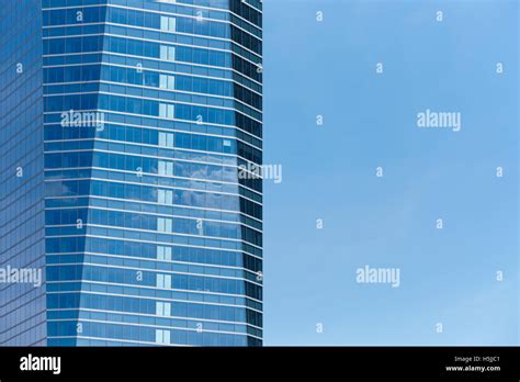 Modern Metallic And Glass Building Facade In Blue Tone Horizontal
