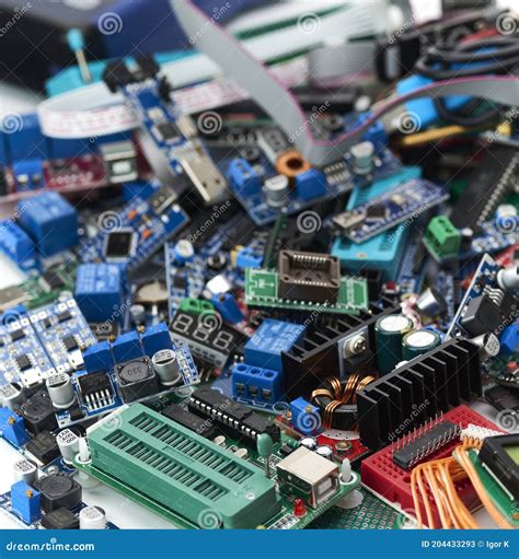 Arduino And Programmers With Peripherals And Expansion Boards Lie On A