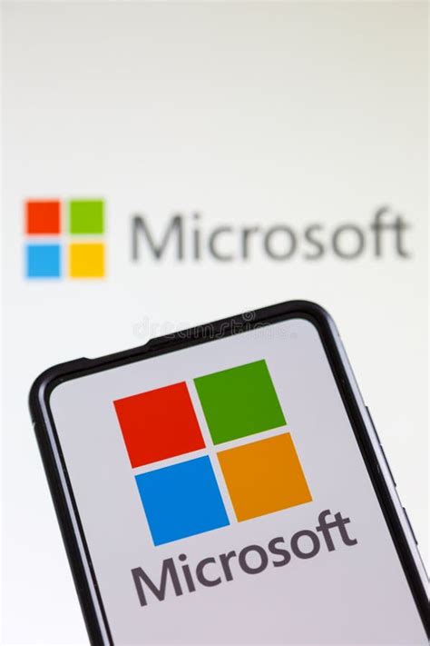 Microsoft Logo Of The Software Company On A Mobile Phone And Computer Screen Editorial Image