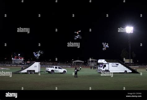 Three Motorcyclists Jumping Simultaneously Stunt Evil K Style Stock