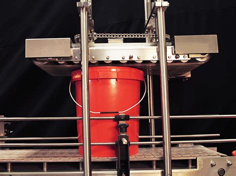 Inline Lid Dispenser Compression Machine