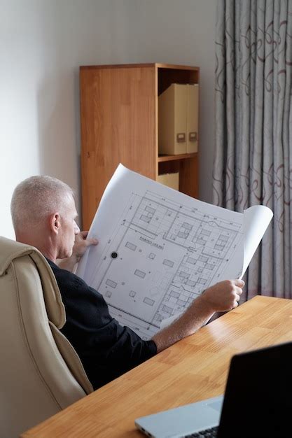 Free Photo Man Checking Construction Plan