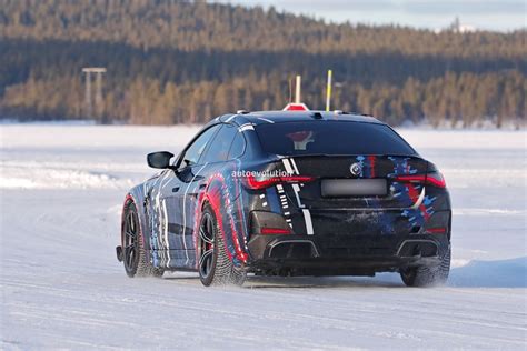 Upcoming BMW M Quad Motor EV Spied Cold Weather Testing With M3 CS Grille I4 Bodyshell