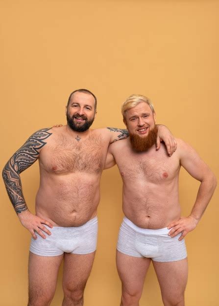 Free Photo Front View Men Posing Together In Studio