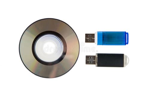 Data Bank A Small Cd Rom With Information Lies Next To 2 Flash Drives Isolated On White Stock